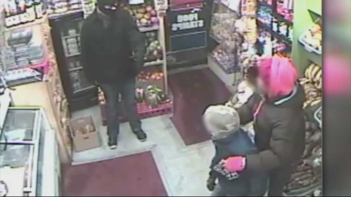 Mom shields son as armed robber waves gun