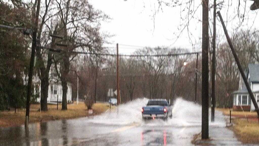 Photos: Torrential rain floods roads, strands drivers