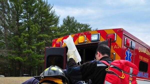 Images: Crews rescue man trapped under tree