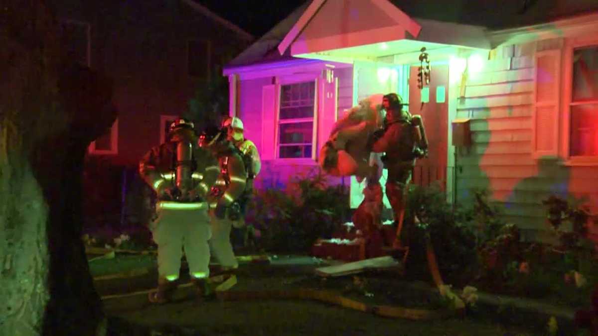Family rescued from burning home