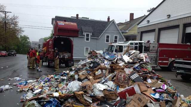 Firefighters put out fire on trash truck