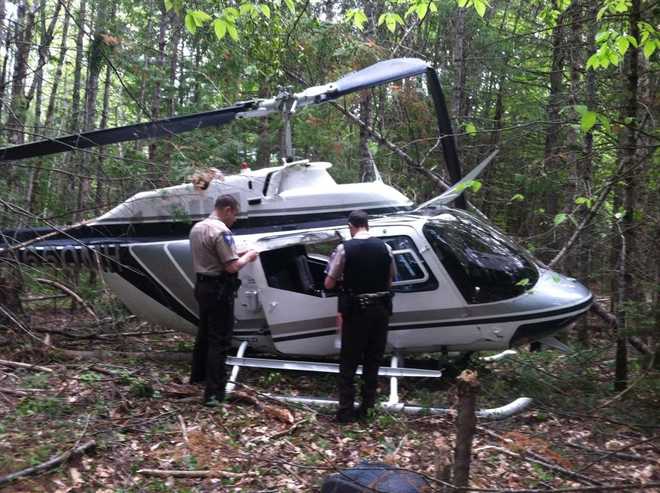 Helicopter crashes into trees, no injuries reported
