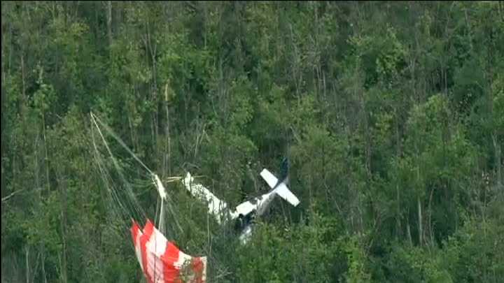Photos: Small plane crashes in wooded area