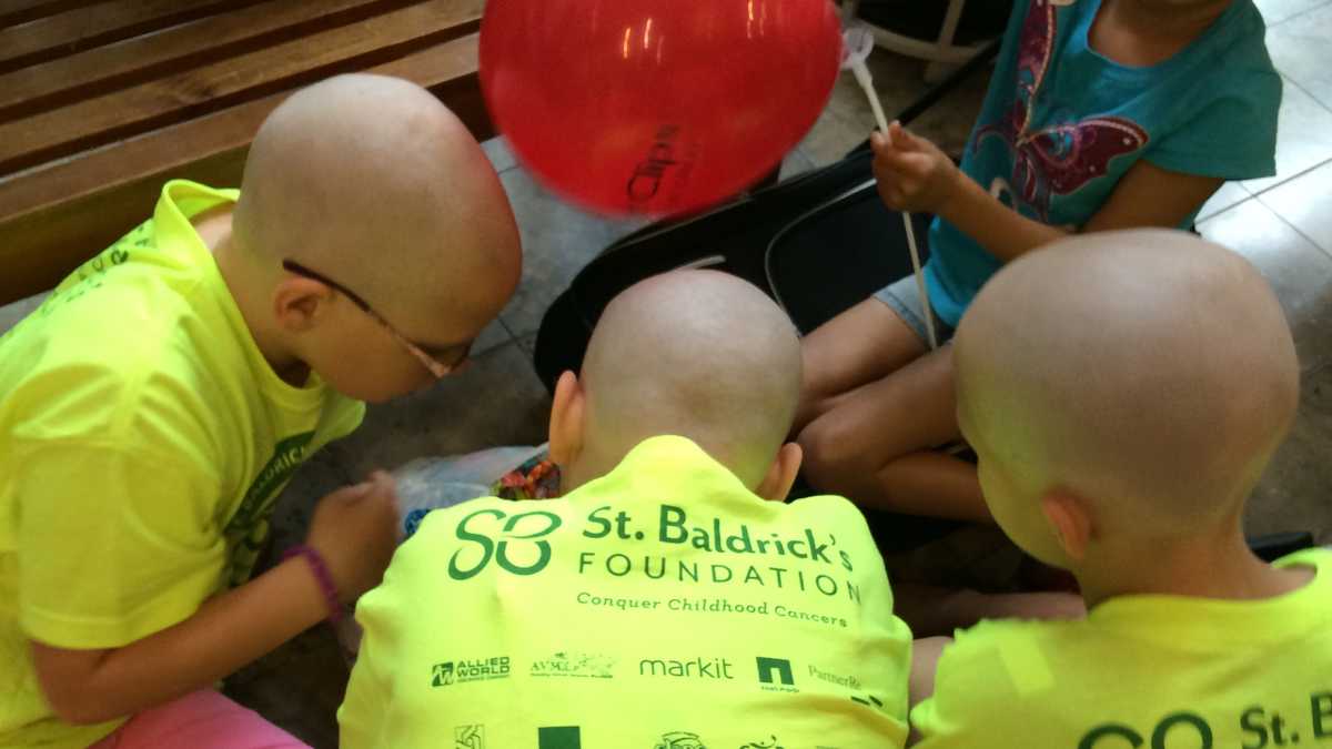 Photos: Moms shave heads for kids with cancer