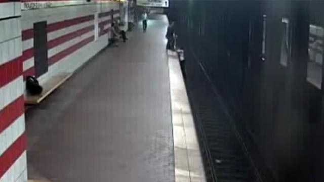 Video shows woman falling onto Red Line tracks