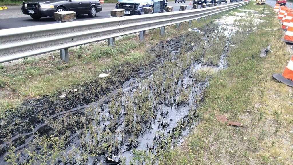 Photos: Fatal tanker rollover spills asphalt on highway