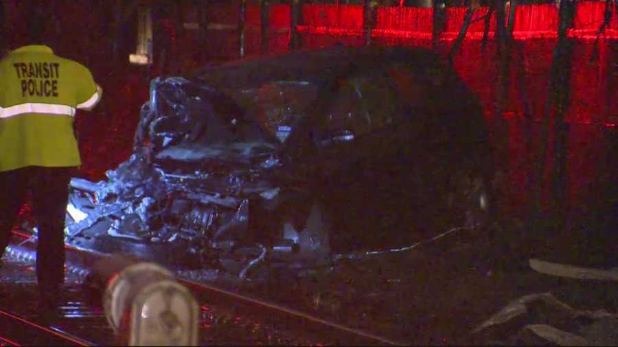 Woman takes wrong turn; car hit, dragged 100 feet by train