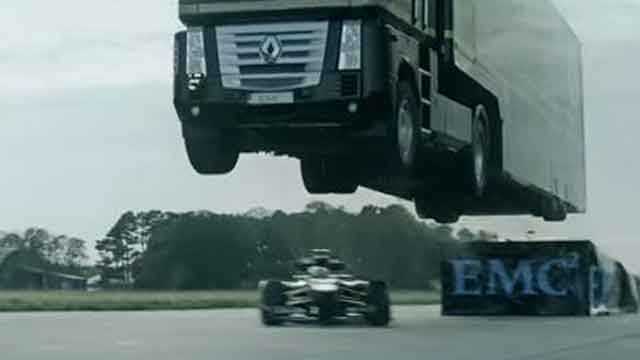 Big rig jumps race car in record-setting EMC stunt