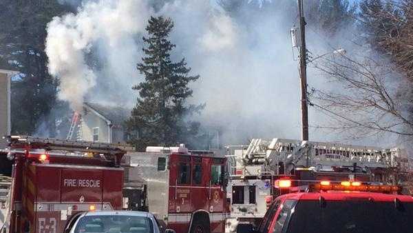 Crews battle garage, house fire