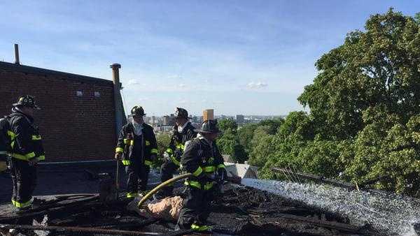 Crews battle 3-alarm brownstone fire