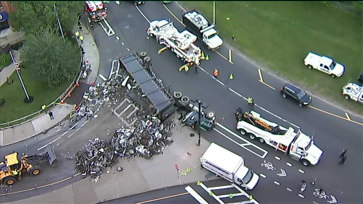 Scrap metal spills on street in truck rollover
