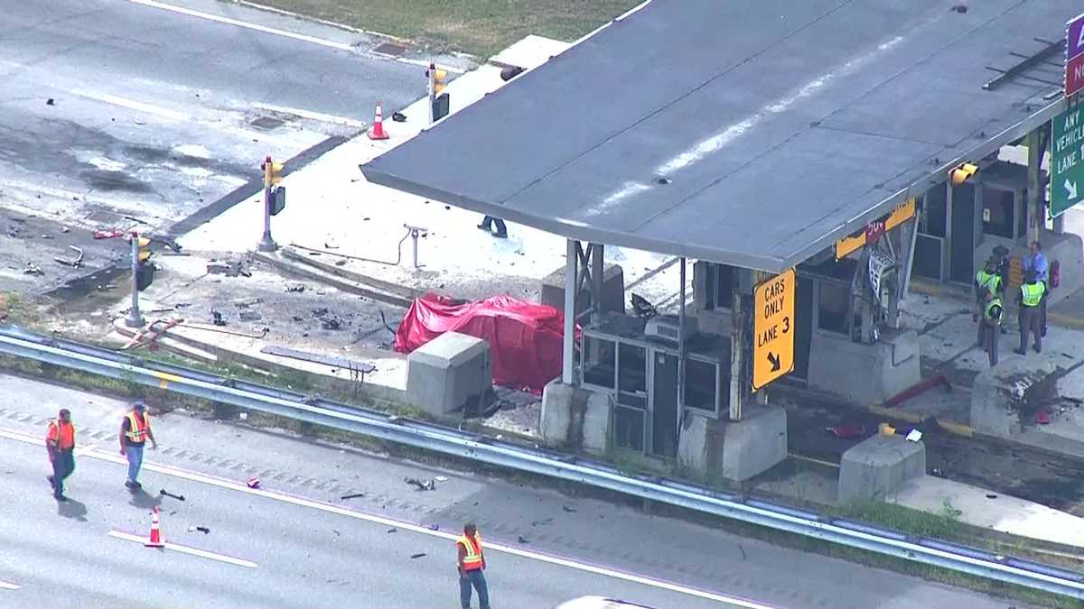 Photos: Car crashes into turnpike toll booth