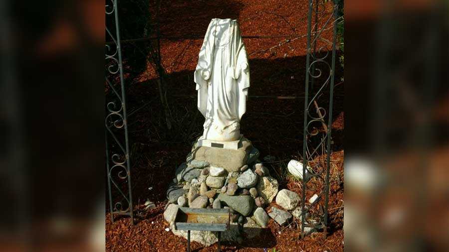 Head smashed off church statue, hands broken off others
