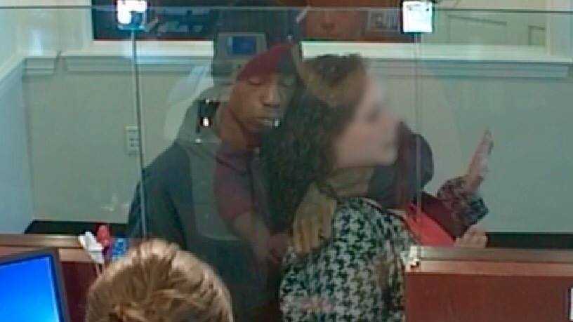 Armed bank robber held teller in stranglehold