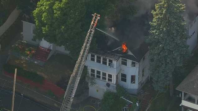 Firefighters battle 4-alarm fire in Lawrence
