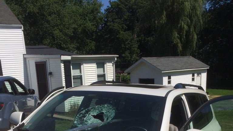 Metal pole pierces windshield inches from driver's head