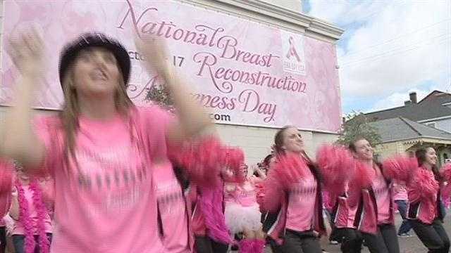 Women raise awareness for breast cancer with parade