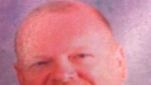 Resentencing delayed for ex-cop in body burning