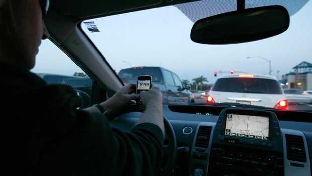Ban on hand-held cell phone use by drivers stalls