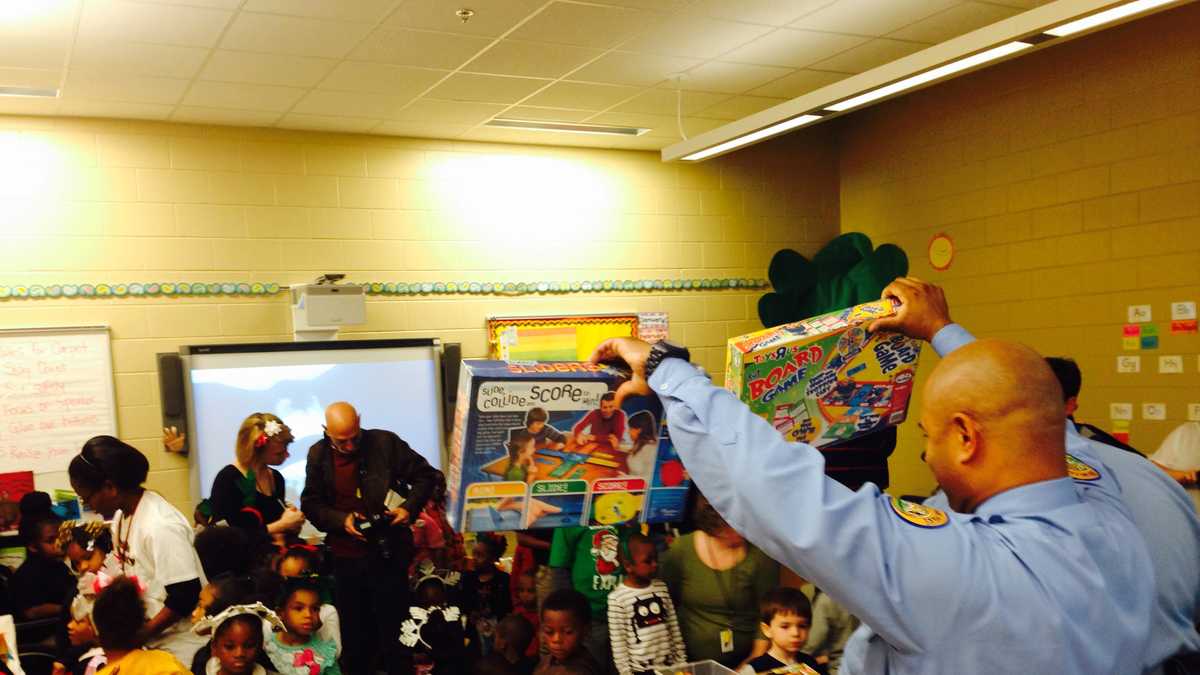 NOPD First District officers deliver toys to students at John Dibert ...