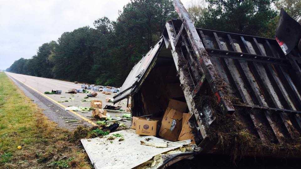State crews clear up I-12 after semi-truck overturns near Hammond