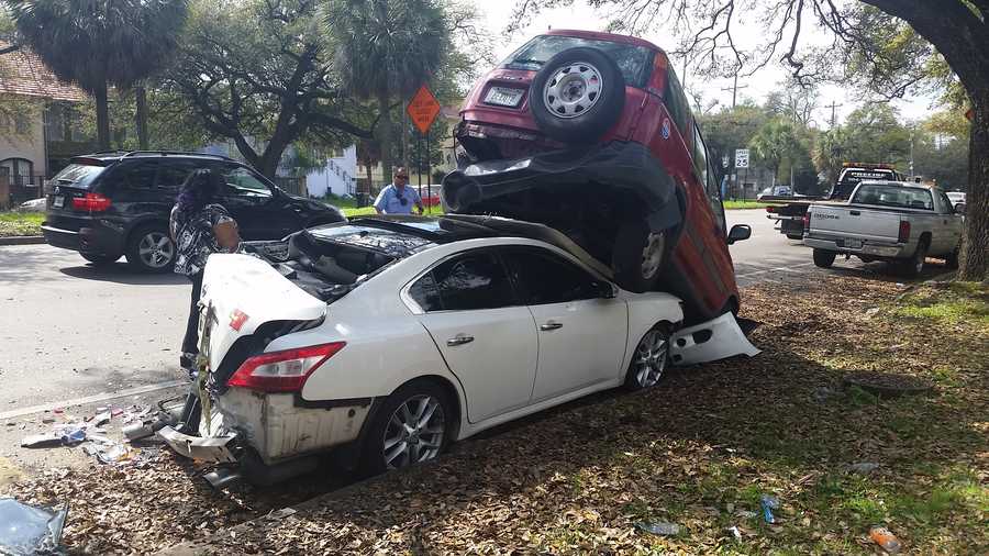 Images: Man rushed to hospital after being pinned between two parked ...