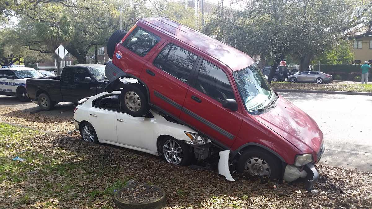 Images: Man rushed to hospital after being pinned between two parked ...