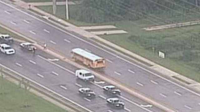 Images: School bus runs over motorcycle