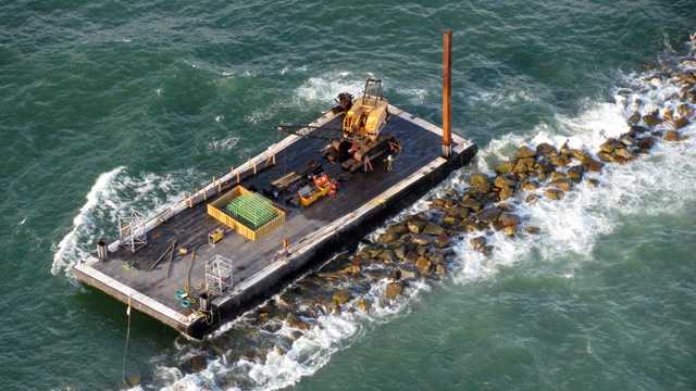 Coast Guard frees stuck barge, tugboat