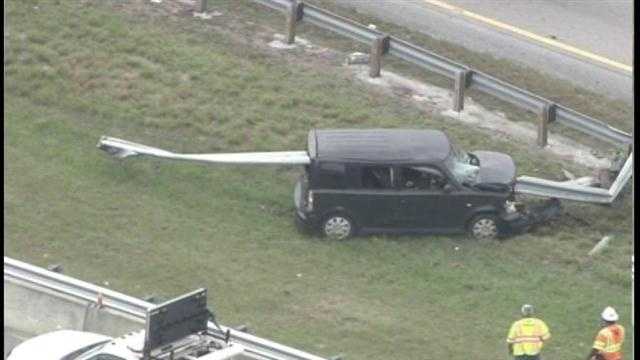 Images: Guardrail goes through front, back of car