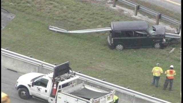 Images: Guardrail goes through front, back of car