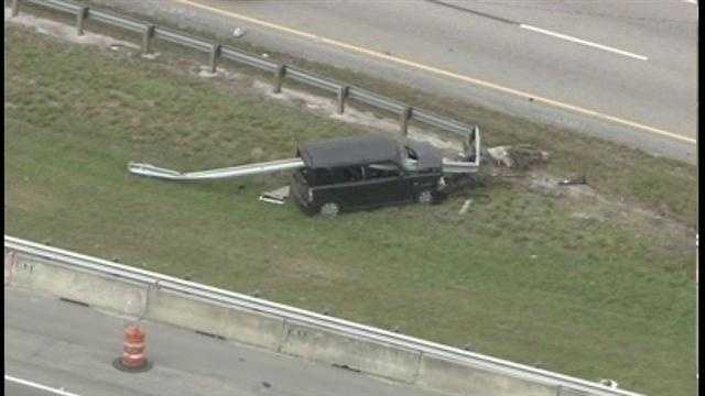 Images: Guardrail goes through front, back of car