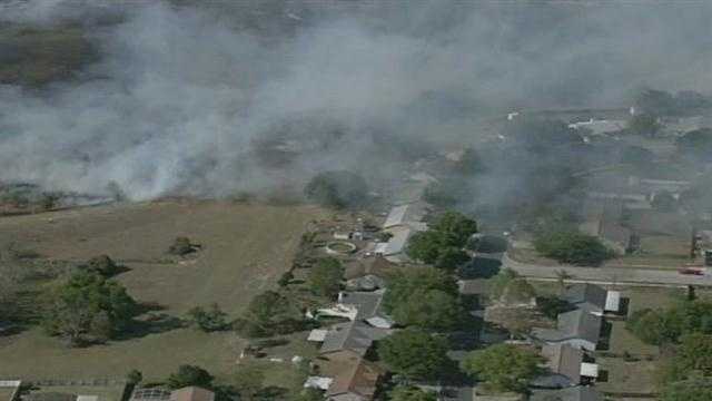 Fire that threatened homes now contained
