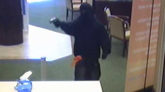 Surveillance photos: Armed men rob bank