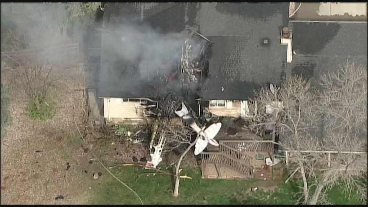Pilot parachutes to safety before plane crashes into house