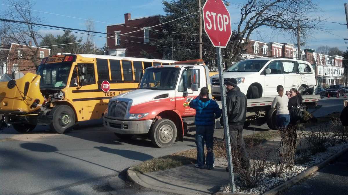 Minivan, school bus collide