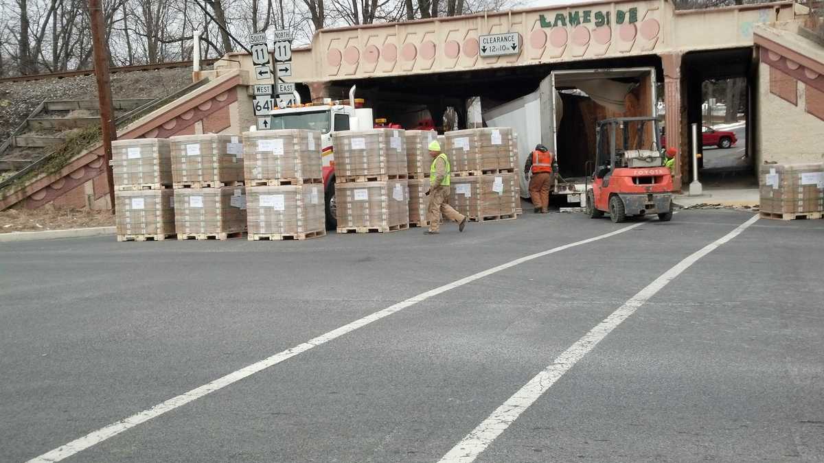 Photos: Tractor-trailer becomes wedged under bridge