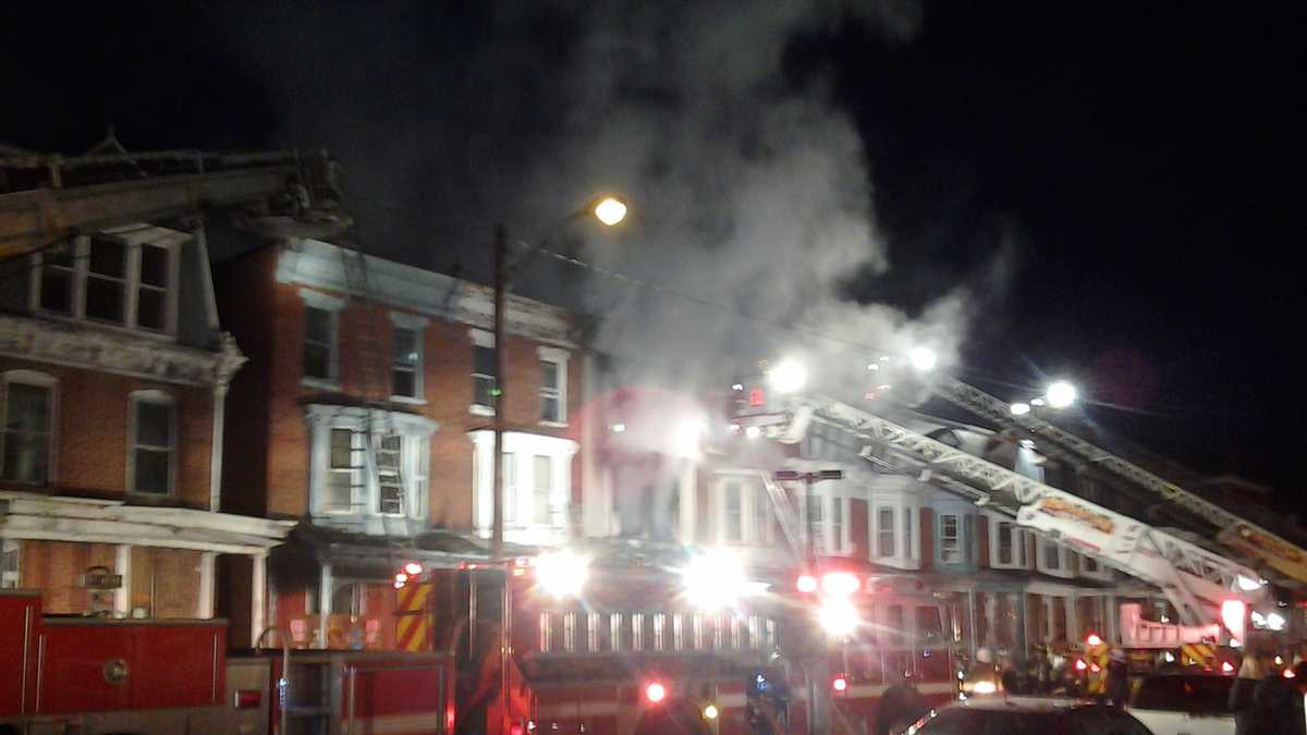 Photos: Arson blamed for row home fire