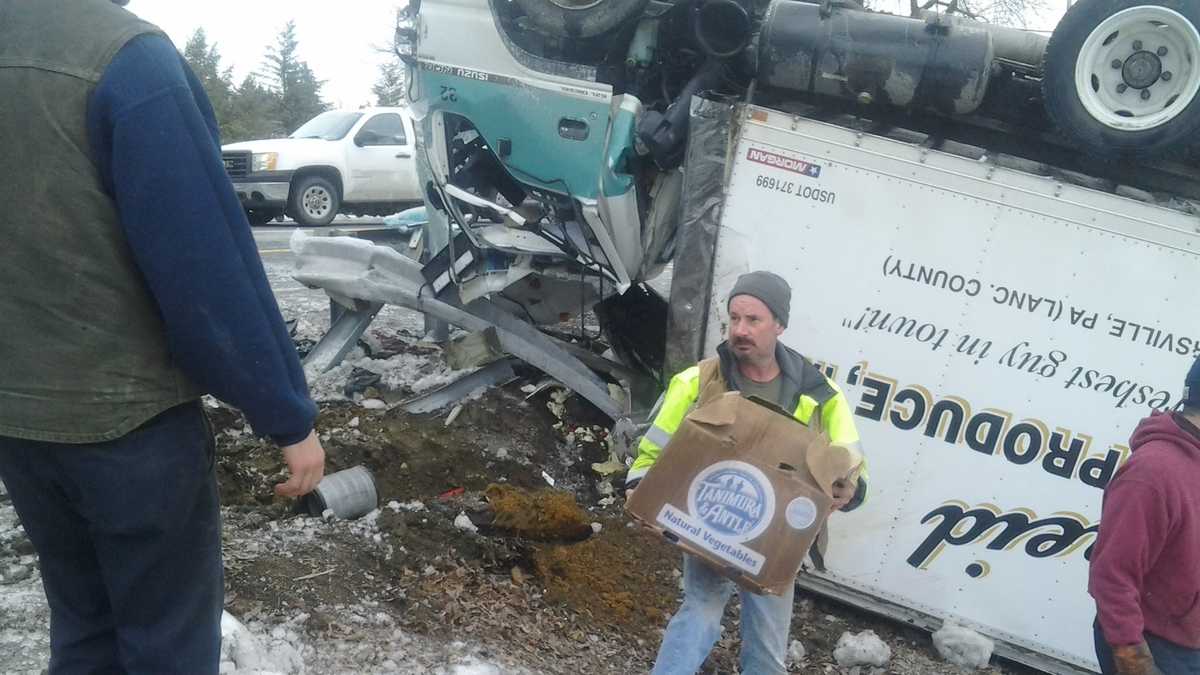 Produce truck flips in morning crash