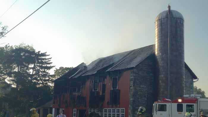 Crews battle barn fire