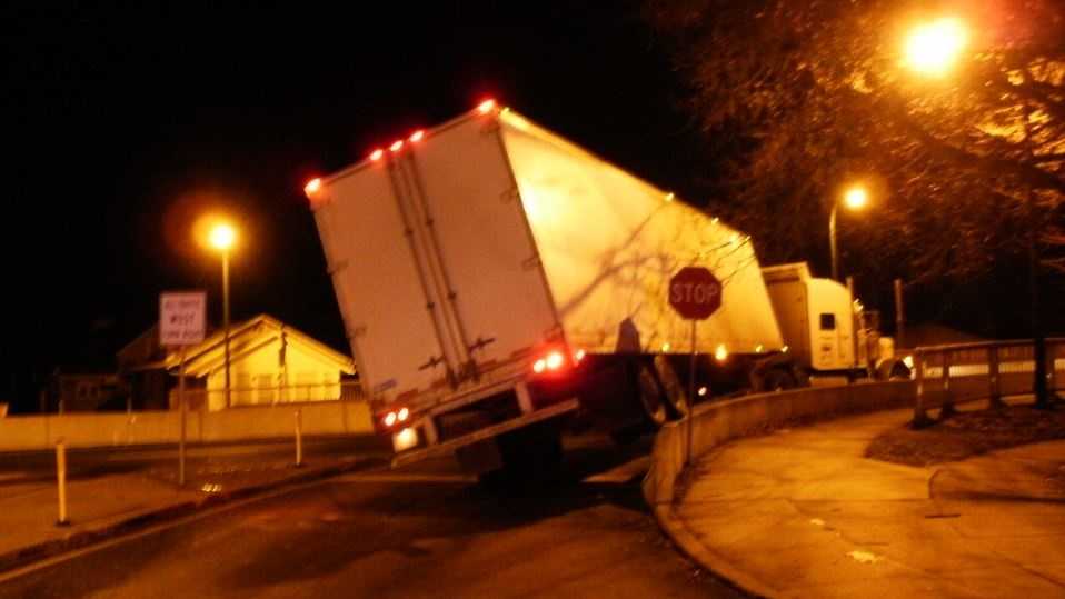 Photos: Truck gets hung up on curb