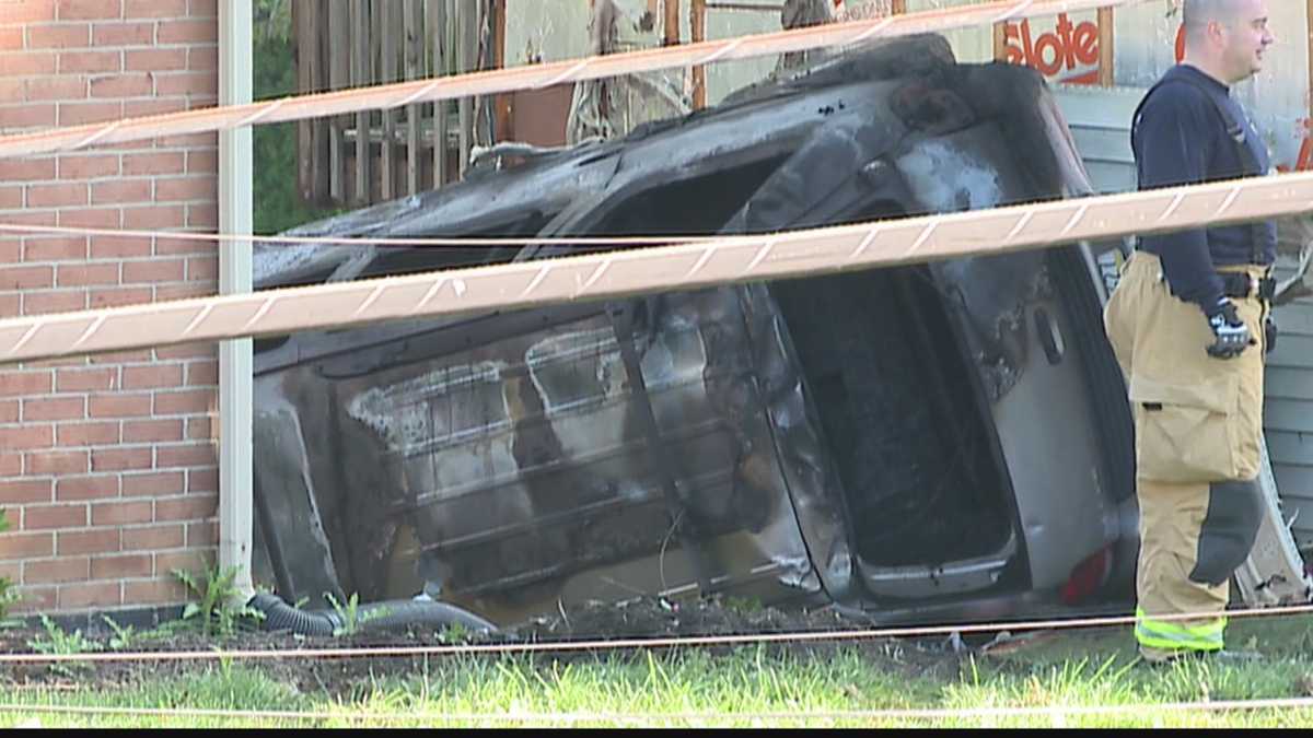 SUV runs over mailboxes, shears off pole, hits house and bursts into flames