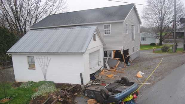 Photos: Car hits building, rolls over