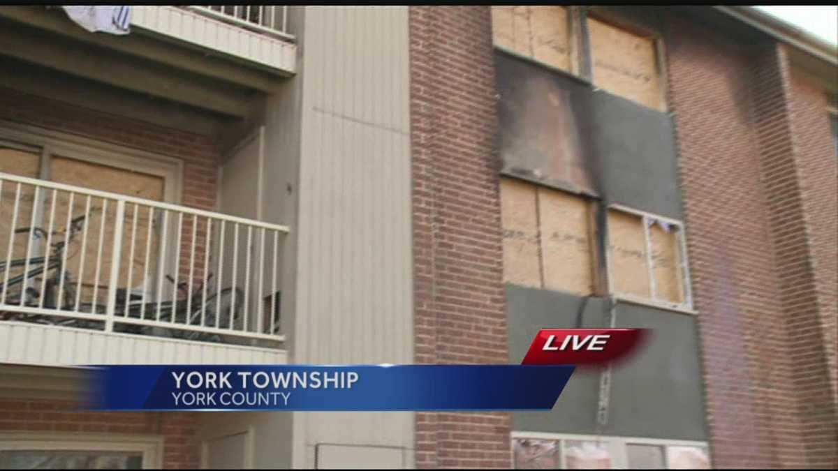 Residents evacuate burning apartment building
