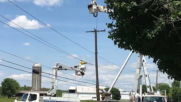 Two-vehicle crash topples utility pole