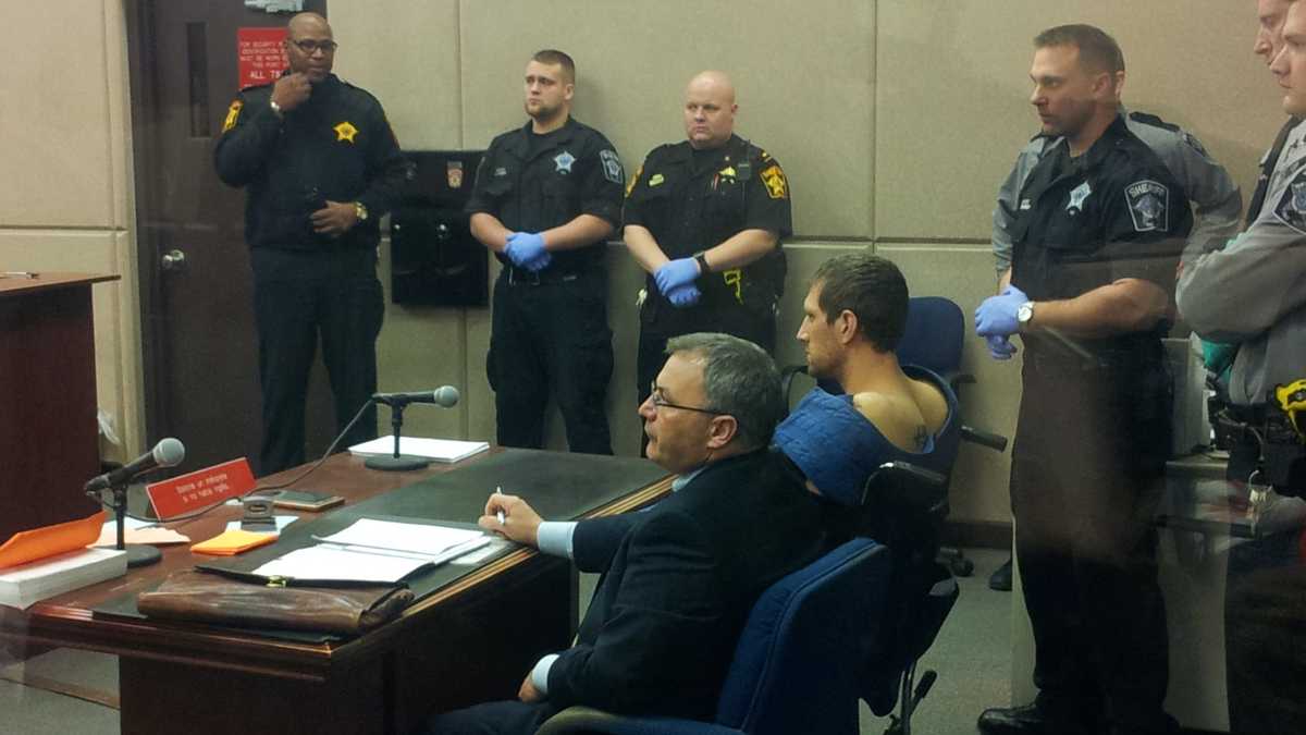 Husband of slain officer charged