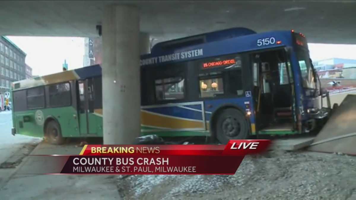 Crash wedges bus under I-794 bridge