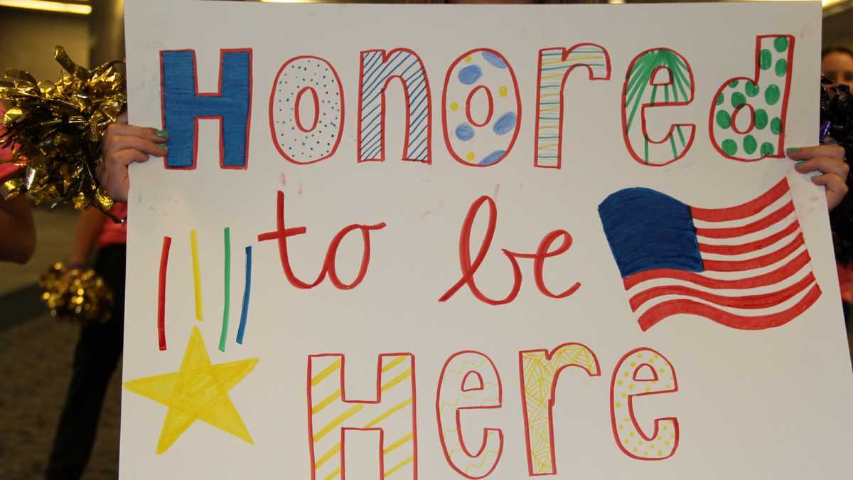 Photos: Honor Flight vets greeted by signs, cheering, patriotism
