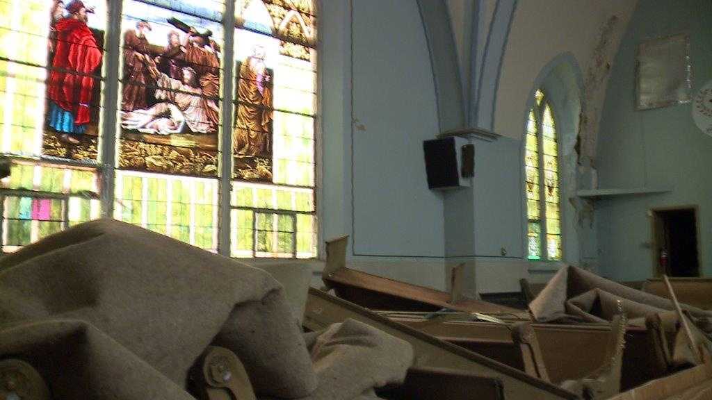 Crumbling church having estate sale