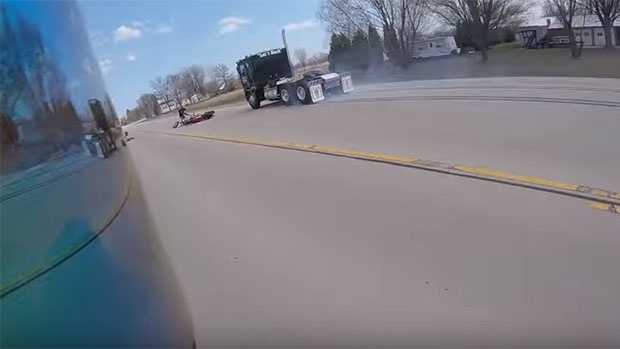 Video shows near miss between biker, semi